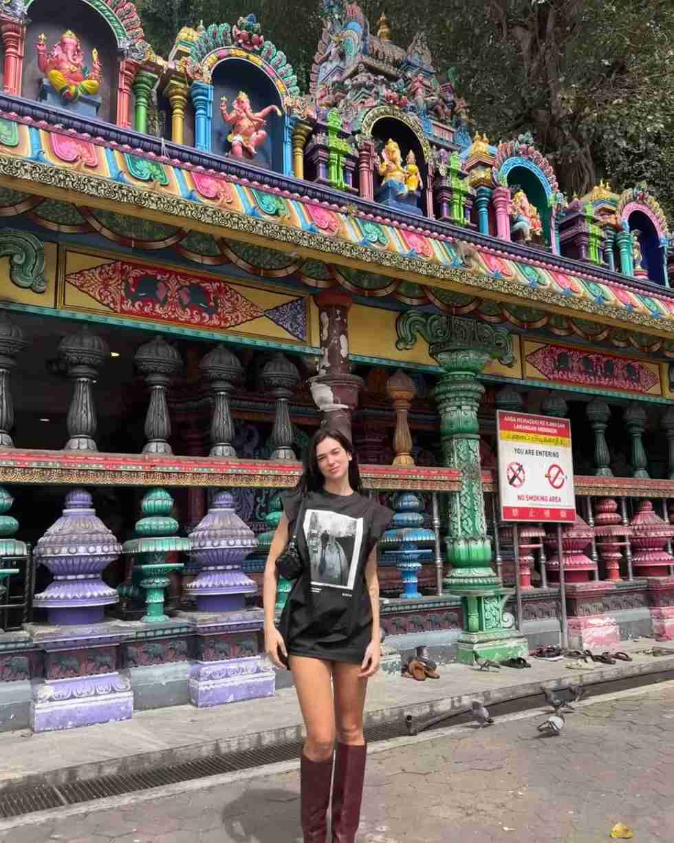 Dua Lipa Ditches the Pants for a Graphic Tee and Maroon Boots - leurr